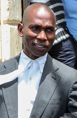 Lawyer Jomo Thomas returns accused killer to cops - Searchlight