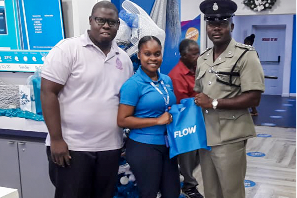 Flow donates to police caroling contest - Searchlight